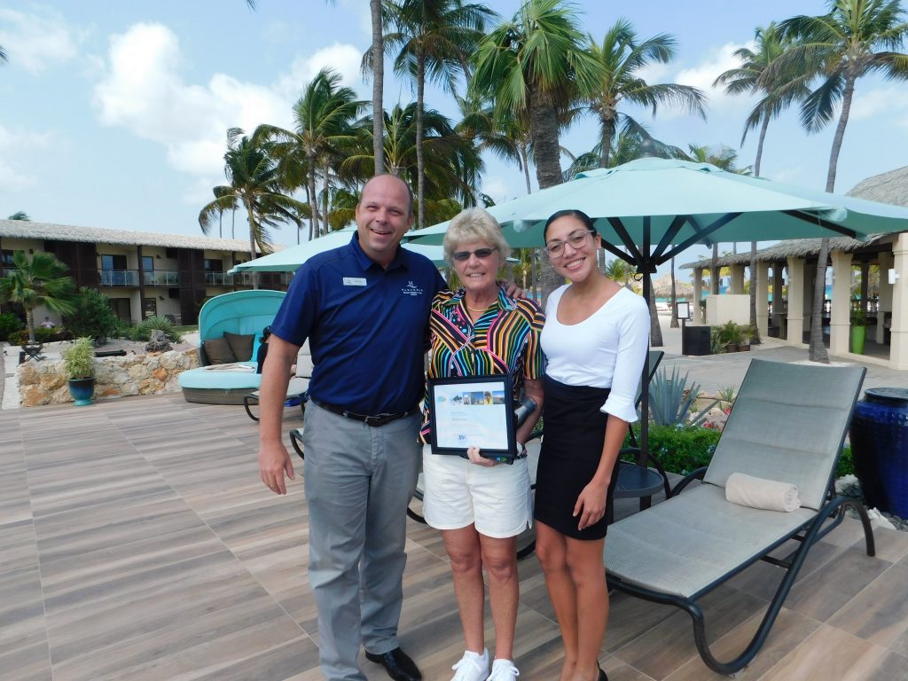 The Aruba Tourism Authority honor loyal visitor at Manchebo – Aruba Today
