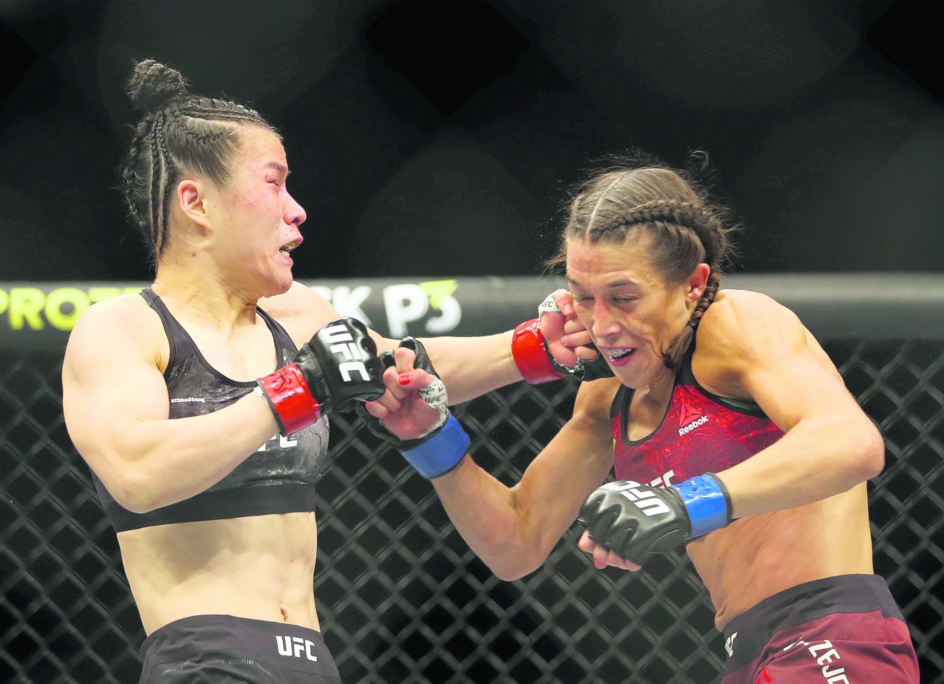 Zhang Weili, Israel Adesanya keep title belts at UFC 248 – Aruba Today
