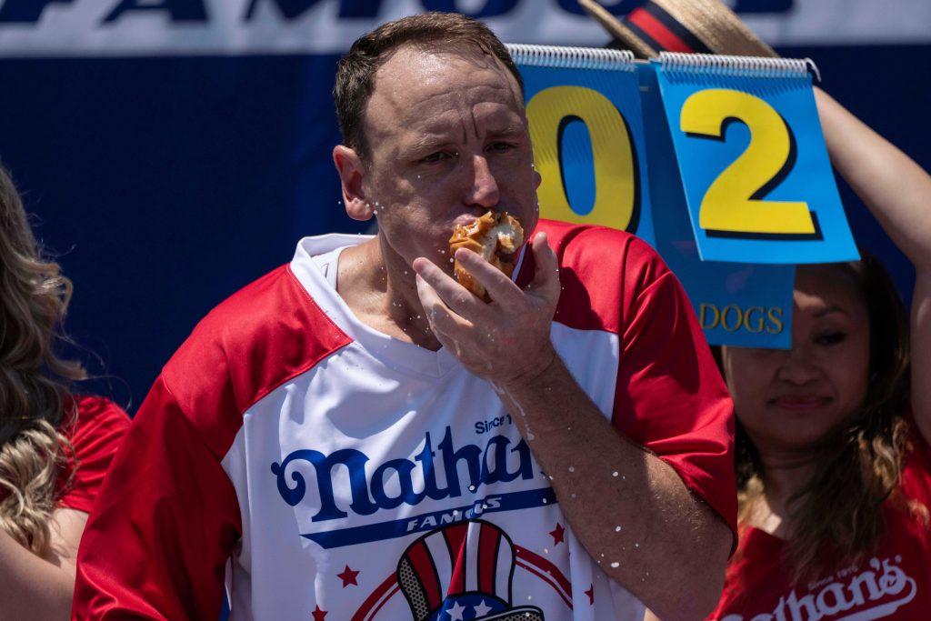 Joey Chestnut reclaims title in Nathan’s Famous hot dog eating contest ...